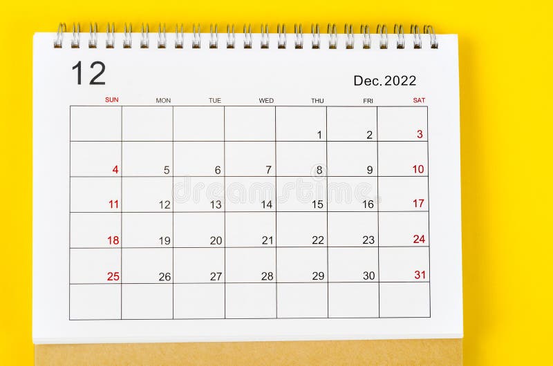 The December 2022 Monthly Desk Calendar for 2022 Year on Yellow ...