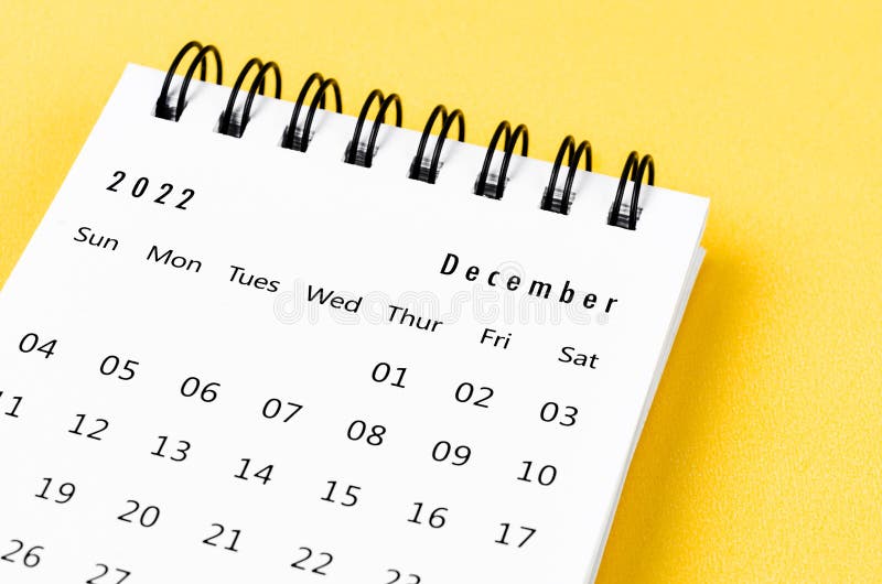 The December 2022 Monthly Desk Calendar for 2022 Year on Yellow ...