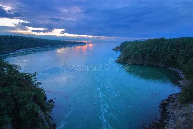 The Deception Pass during a Cloudy Sunset Stock Image - Image of ...