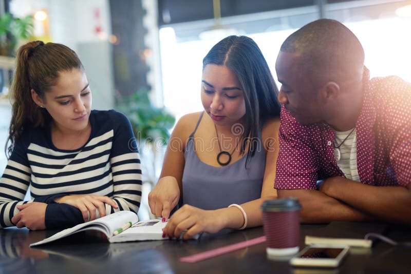 Deciphering the Text Together. a Group of Young Friends Having a Study ...