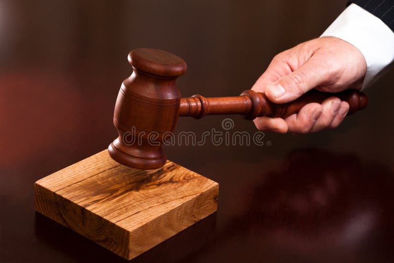 Man Holding Wooden Gavel in Fist on White Stock Image - Image of ...
