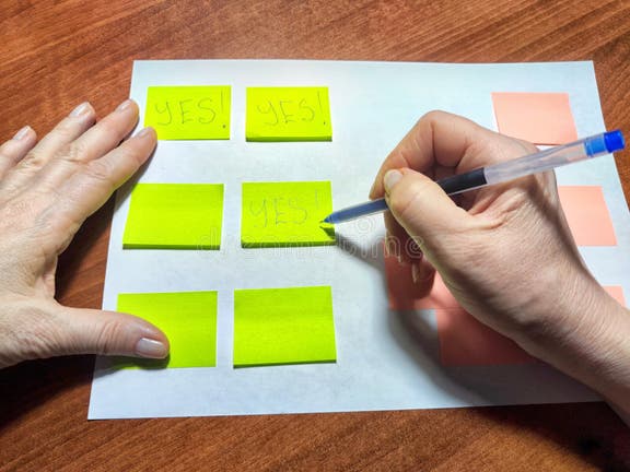 Decision-Making Process with Sticky Notes on Table. a Person is ...