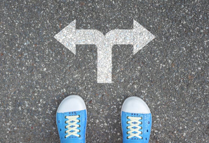 Standing at the Crossroad Making Decision Which Way To Go Stock Photo ...
