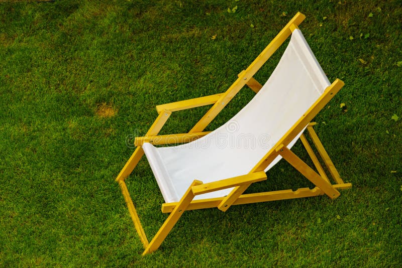 Deck chair in garden stock image. Image of garden, outdoors - 324426553