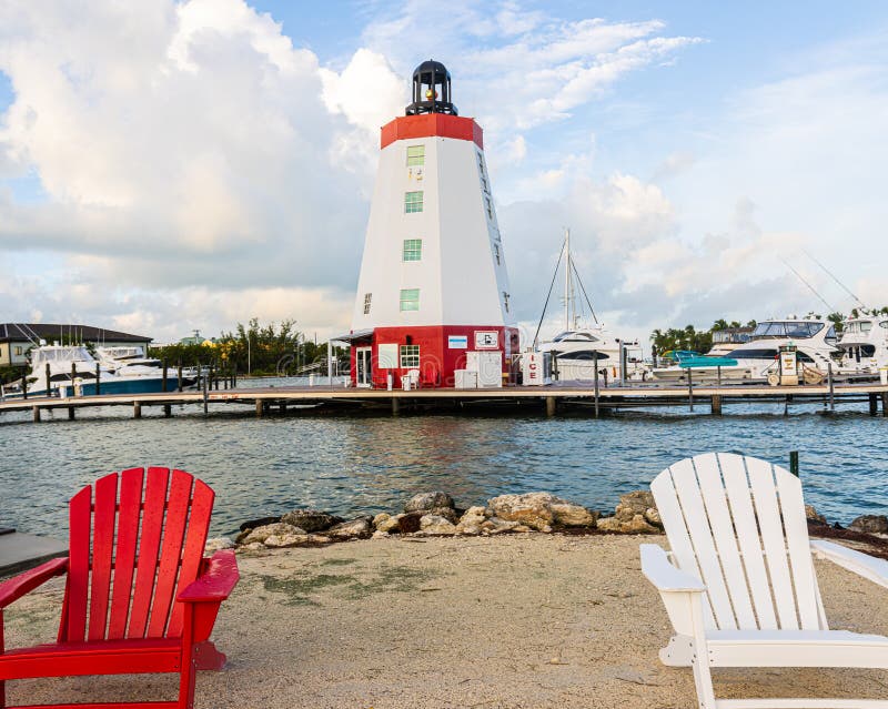Deck Chairs and Lighthouse at Marina Stock Image - Image of tower ...
