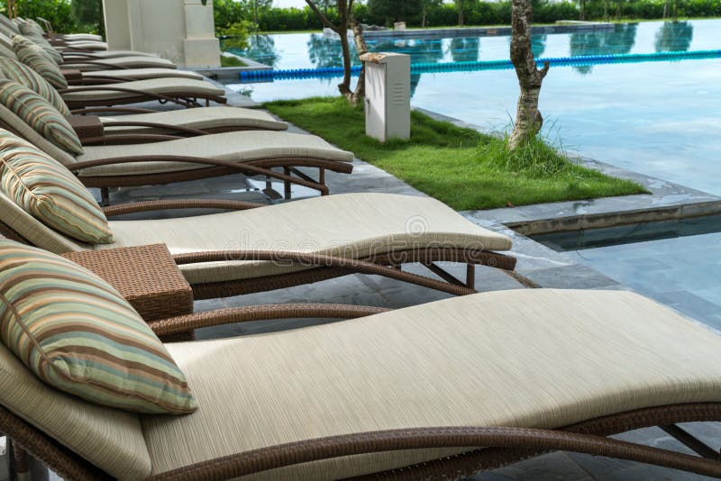 Deck Chairs by the Pool in Resort Stock Image - Image of holiday ...
