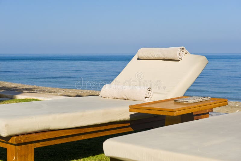 Deck chairs in the sun stock image. Image of idyllic - 13539999