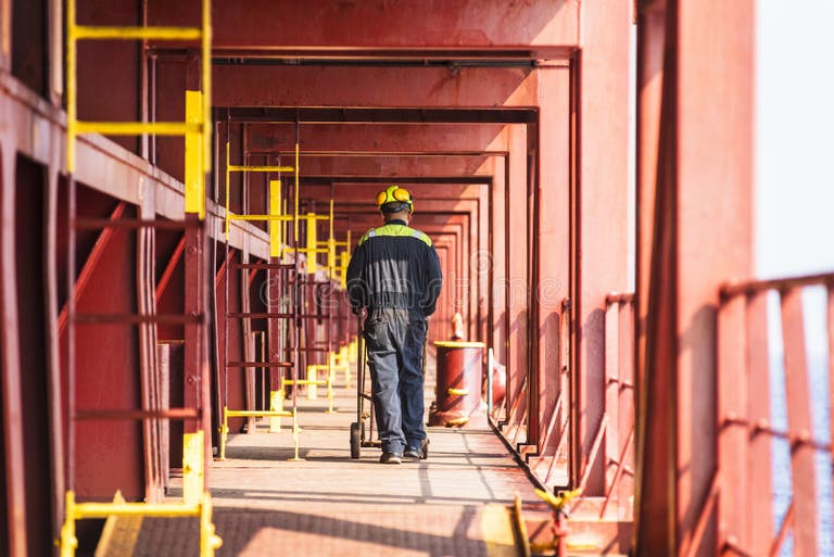 A Deck Crew of a Merchant Ship Walking Across the Deck during His daily ...