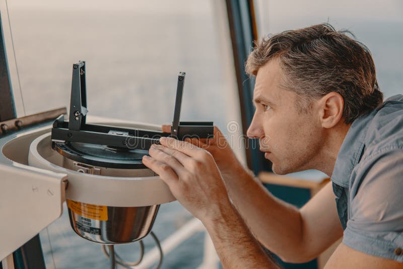 Deck Officer Taking Magnetic Compass Error Onboard of Vessel Stock ...
