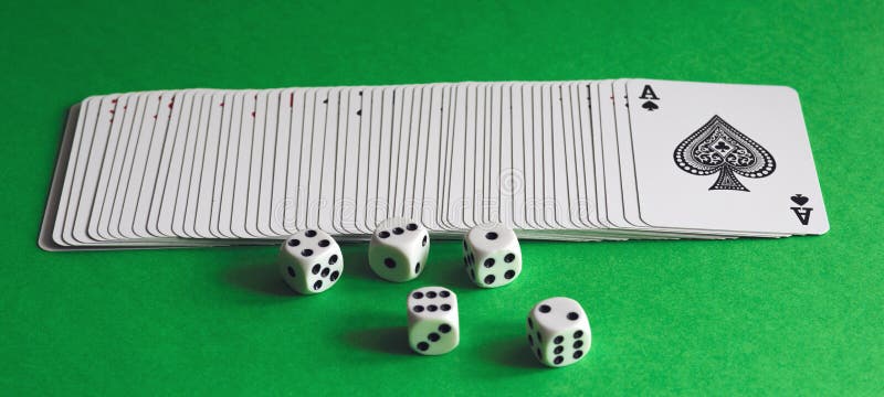 A Deck of Playing Cards and Dice on a Green Table Stock Image - Image ...
