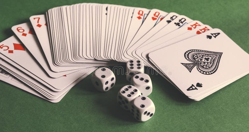 A Deck of Playing Cards and Dice on a Green Table Stock Image - Image ...