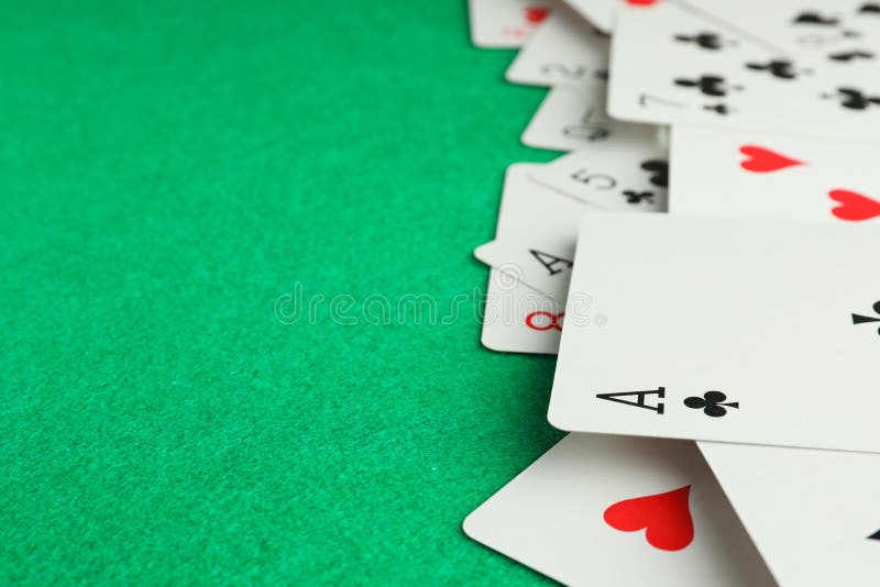 Deck of Playing Cards on Green Table, Closeup. Space for Text Stock ...