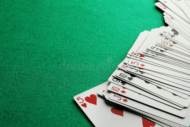 Fan of Playing Cards on Green Table, Top View. Space for Text Stock ...