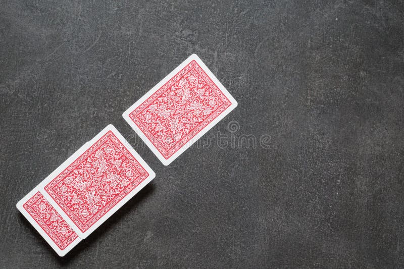 Deck of Playing Cards and One Card Separately Face Down on a Black ...