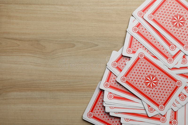 Deck of Playing Cards on Wooden Table, Flat Lay. Space for Text Stock ...