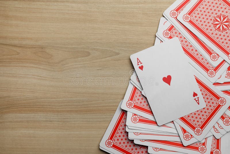 Deck of Playing Cards on Wooden Table, Flat Lay. Space for Text Stock ...