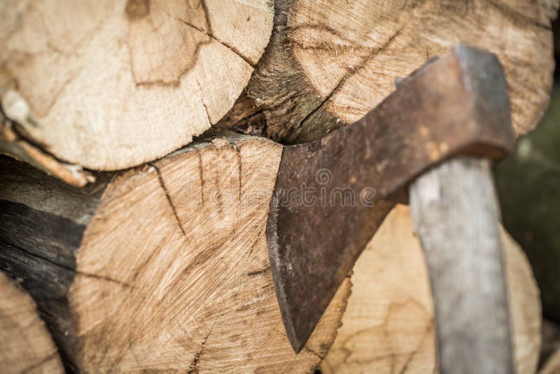 A Deck of Stacked Logs and an Axe Stock Photo - Image of outdoors ...