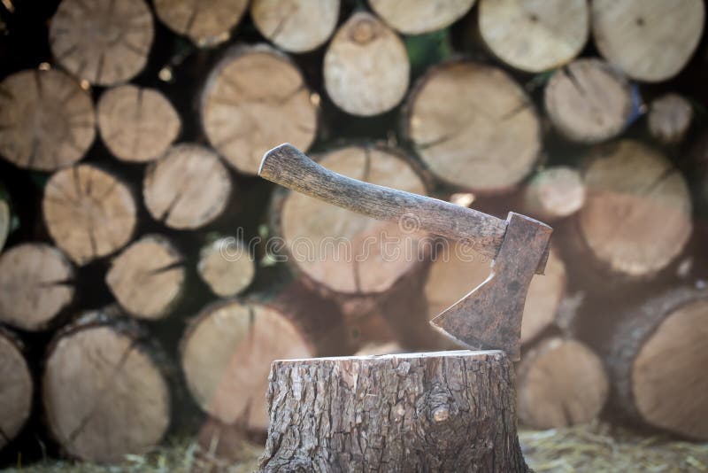 A Deck of Stacked Logs and an Axe Stock Image - Image of instrument ...