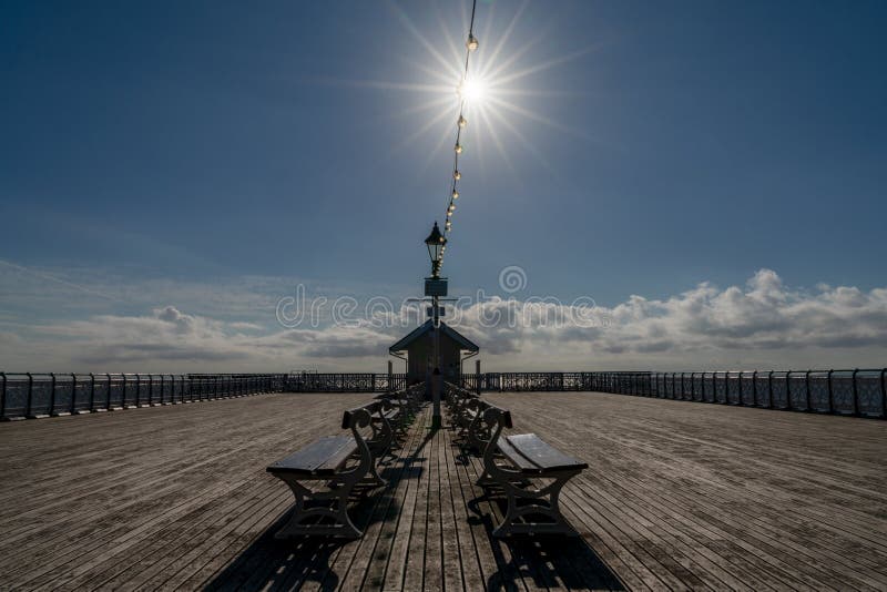 The Deck of the Victorian Pier in Penarth with a Sunburst Stock Photo ...