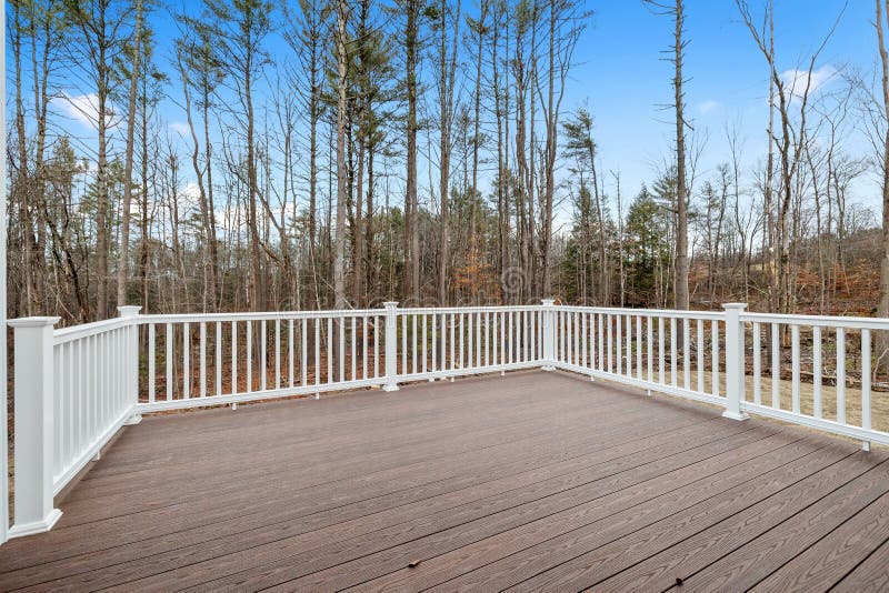 Decking Boards of a Porch with White Railings in a Suburb House Stock ...