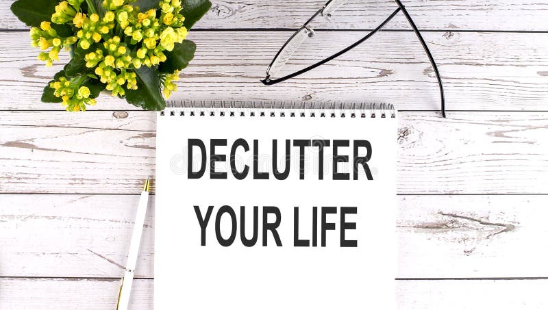 DECLUTTER YOUR LIFE Text Concept Write on Notebook on Wooden Background ...