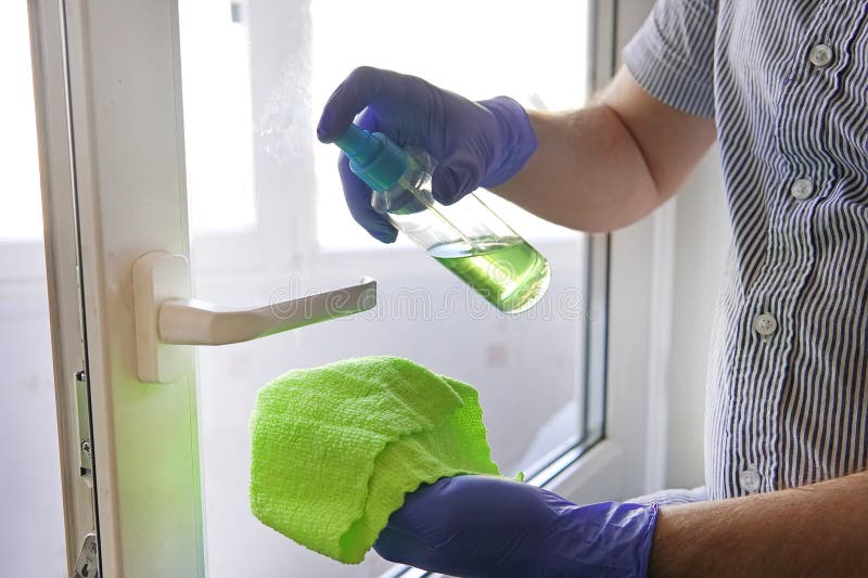 Decontamination of Door Handle. Removing Germs from the Handle on the ...