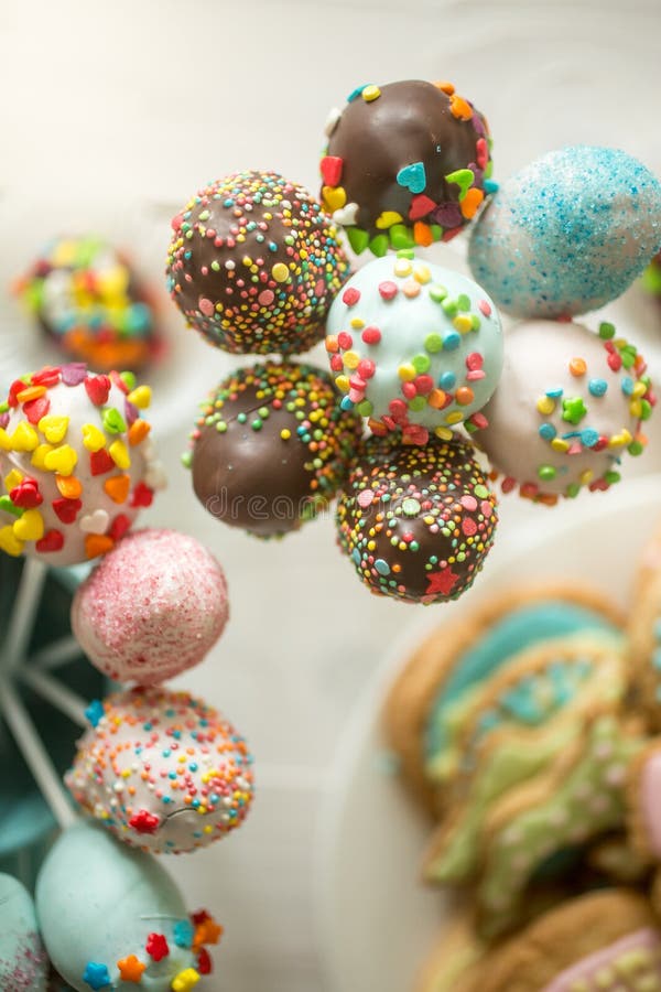 Decorated Cake Pops in Cups on Wooden Table Stock Photo - Image of ...