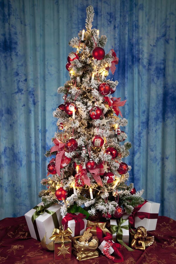 Decorated Christmas Tree with Electric Candles and Presents Stock Photo ...