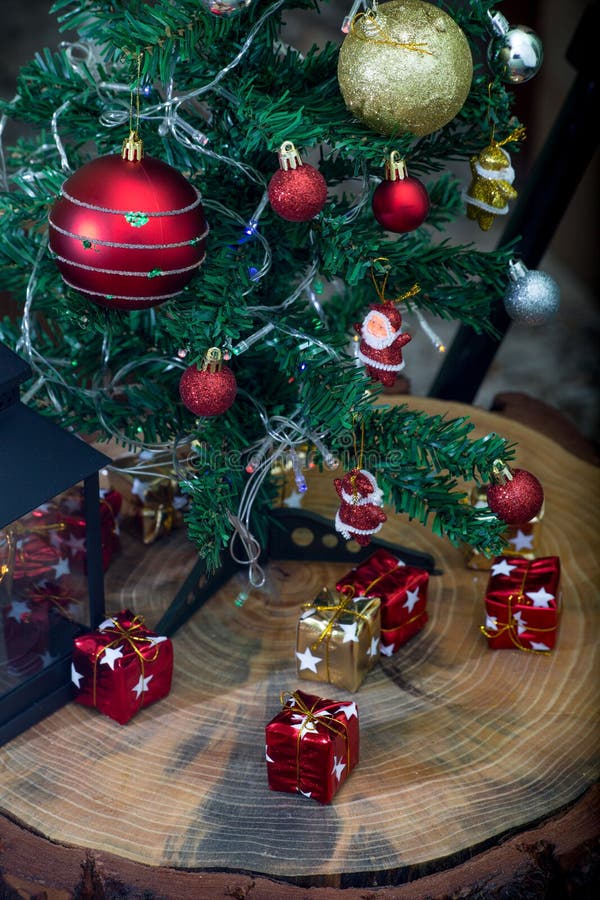 Decorated Christmas Tree on a Rustic Table Stock Photo - Image of ...