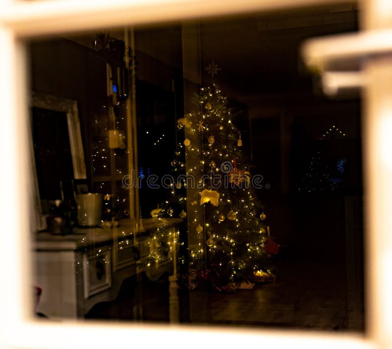 Decorated Christmas Tree Seen Behind a Window Stock Photo - Image of ...