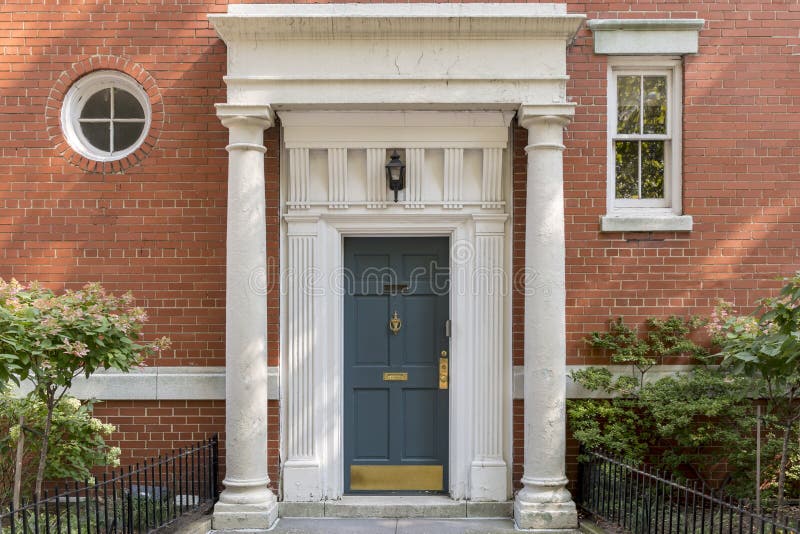 Decorated Main Door, Columns and Brick Wall in New York Stock Image ...