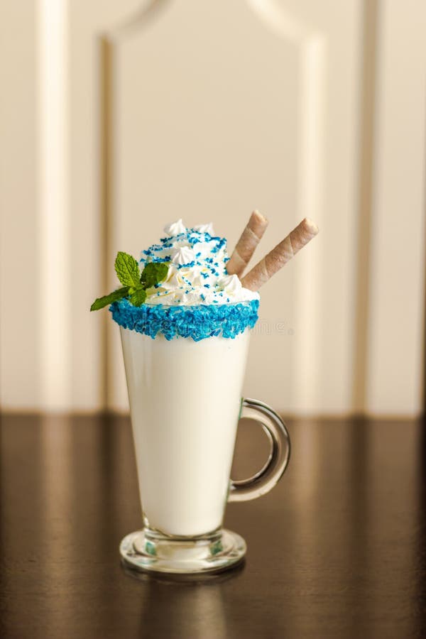 Decorated Milkshakes Blue on a Wooden Table. Copy Space. Stock Photo ...