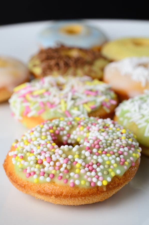 Decorated Mini Doughnut Cakes Stock Image - Image of brown, grouped ...