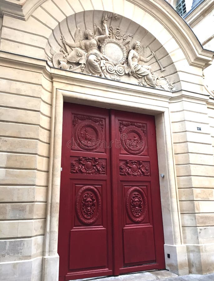 Decorated Red Door in Paris Stock Image - Image of door, ourside: 85643711