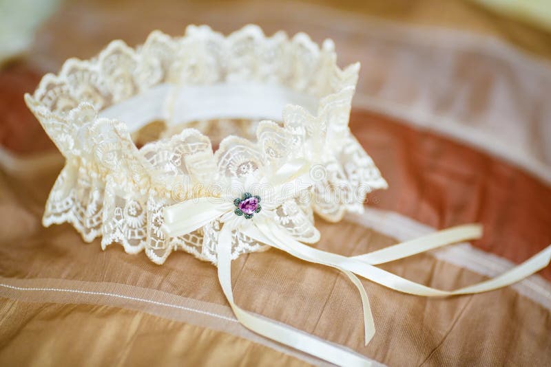 Decorated Wedding Garter on Sofa. Marriage Concept Stock Photo - Image ...