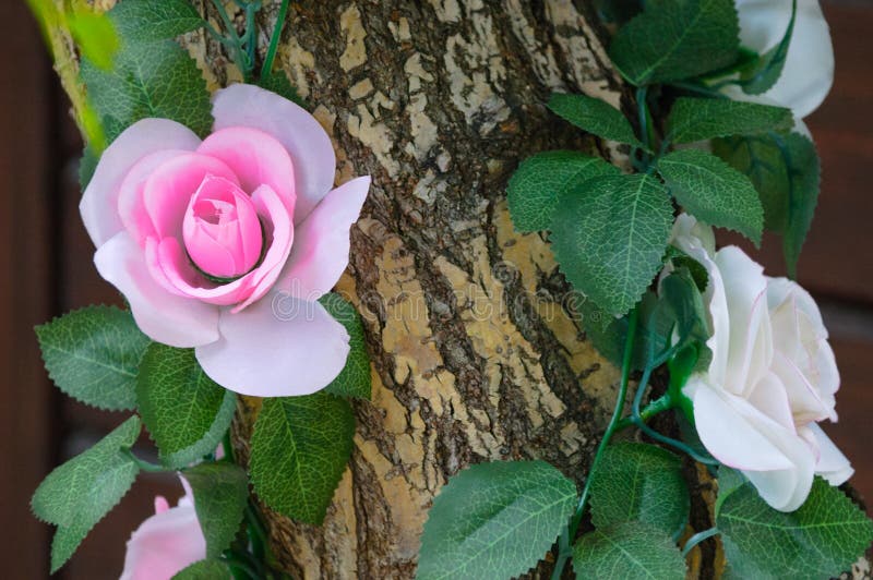 Decorating of Artificial Flowers with a Tree Trunk. Stock Photo - Image ...