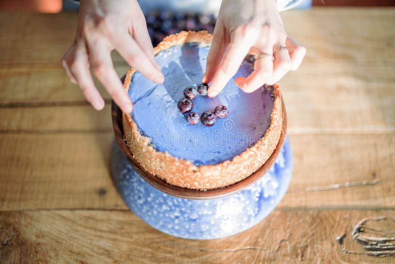 Decorating Cheesecake with Blueberries Stock Photo - Image of sweet ...