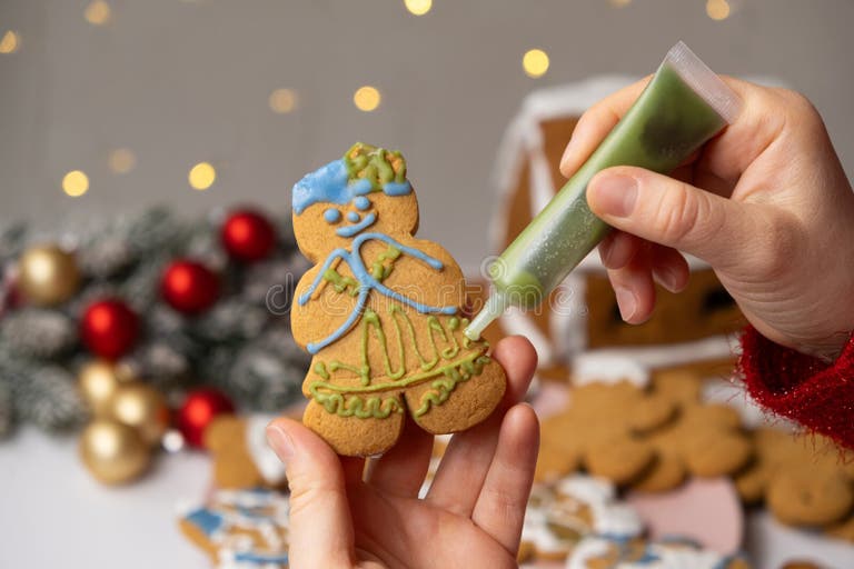 Decorating Christmas Gingerbread with Sugar Multicolored Icing. Stock ...