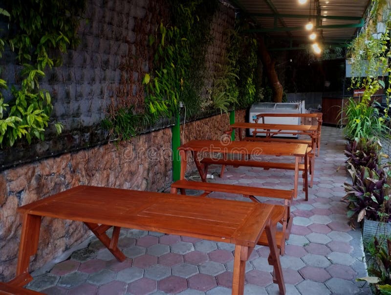 Decorating a Dining Table in an Outdoor Cafe with Various Plant ...