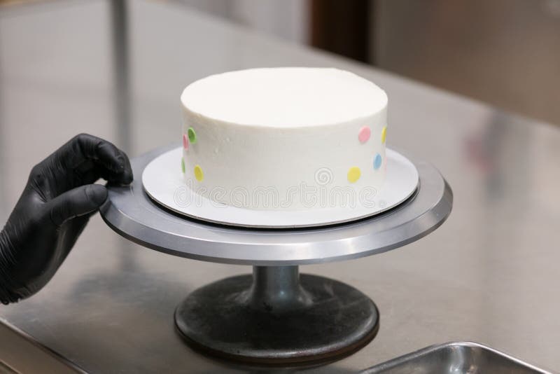 Pastry Chef Designer Decorating Frosted Cup Cake with Multi Colored ...