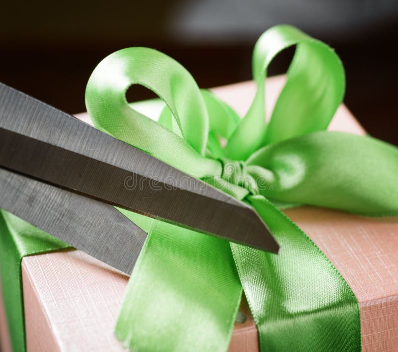Decorating Gift Box with Green Ribbon Using Scissor Stock Photo - Image ...
