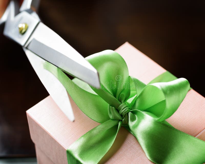 Decorating Gift Box with Green Ribbon Using Scissor Stock Image - Image ...