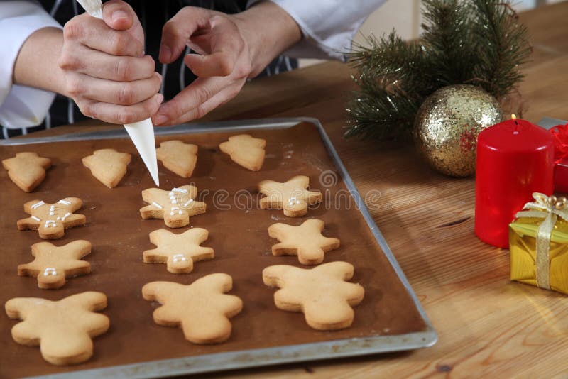 Decorating Ginger Bread Man Stock Image - Image of baker, bakery: 33669669