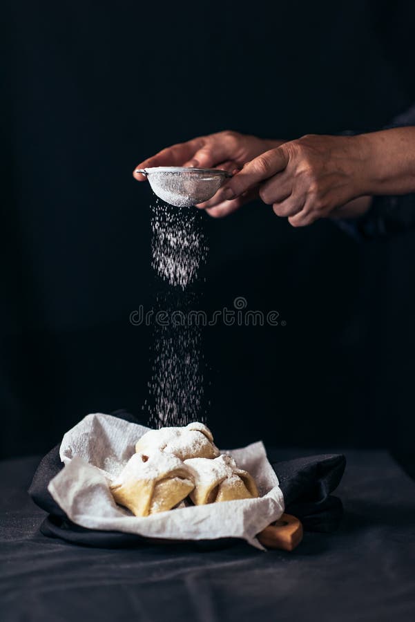 Decorating Gingerbread Cookies with Powdered Sugar Stock Photo - Image ...