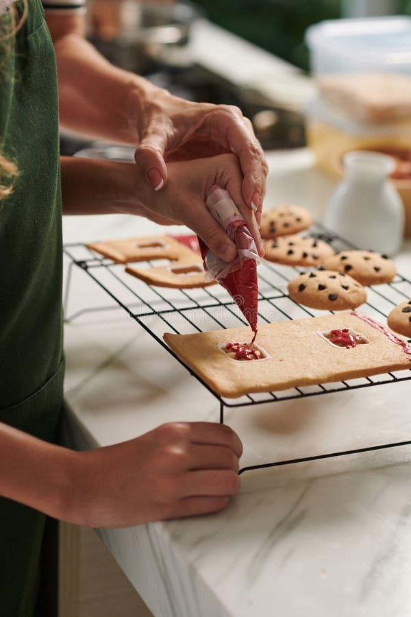 Decorating Gingerbread House with Icing Stock Image - Image of family ...