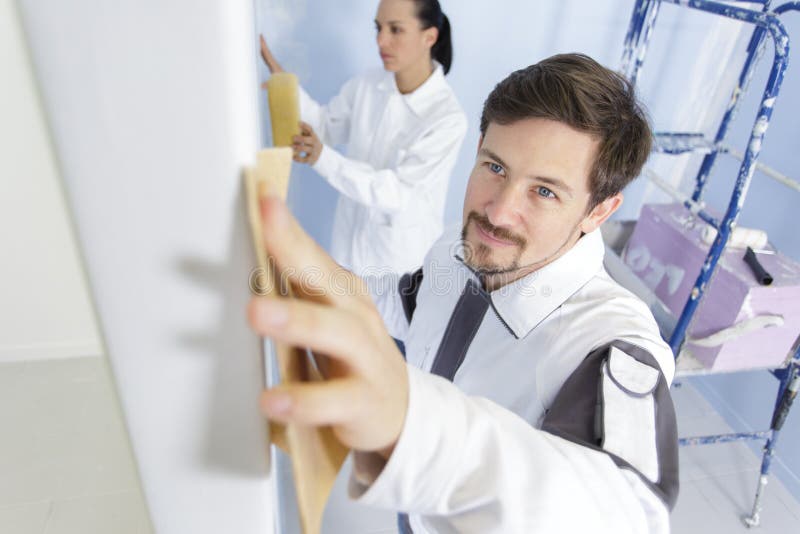 Decorating Team Preparing Wall Stock Photo - Image of renovation, paint ...