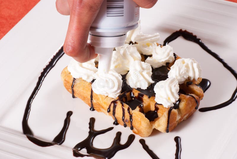 Decorating a Waffle with Whipping Cream Stock Photo - Image of treat ...