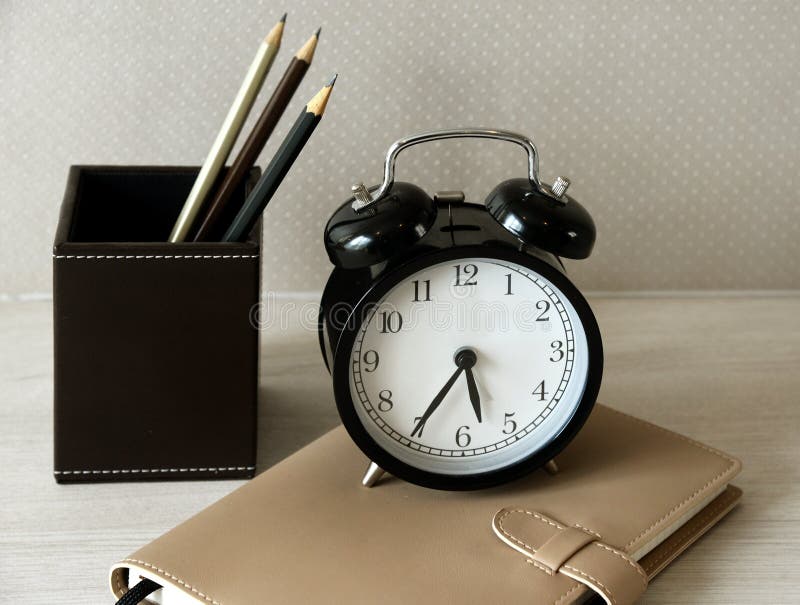 Decoration Clock on Table with Pencil and Book. Stock Photo - Image of ...