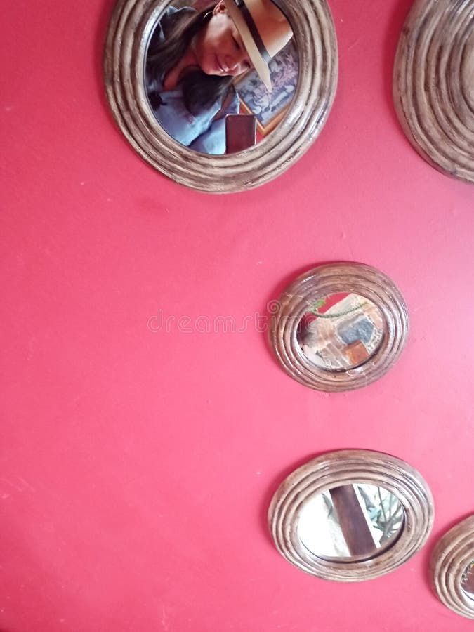 Decoration and Design of Red Wall with Mirrors and Reflection of Woman ...