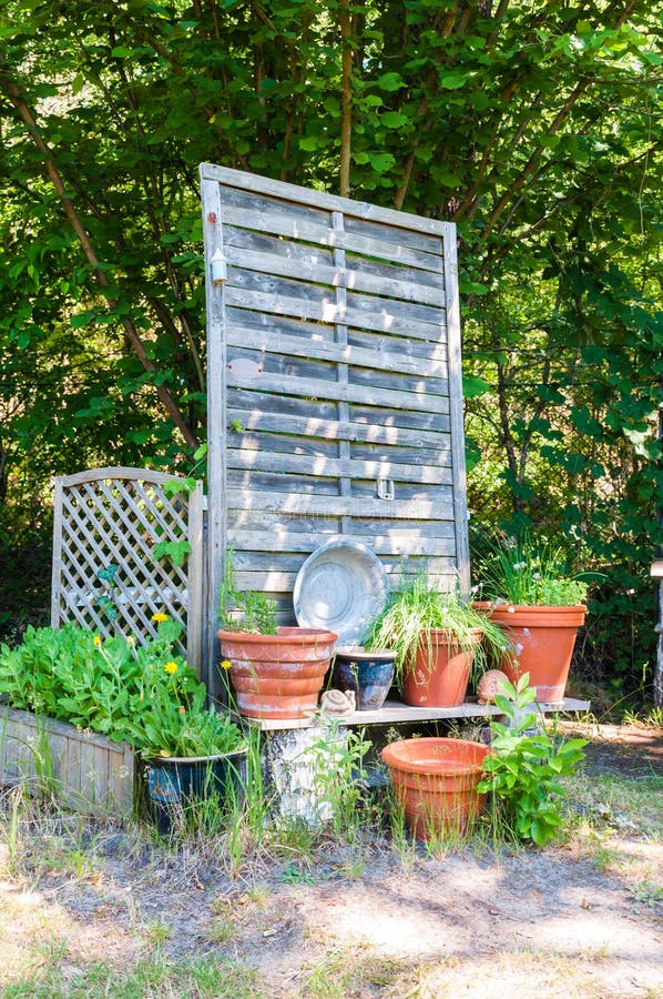 Decoration in a Garden. Flower Pots,panel Wall Stock Image - Image of ...